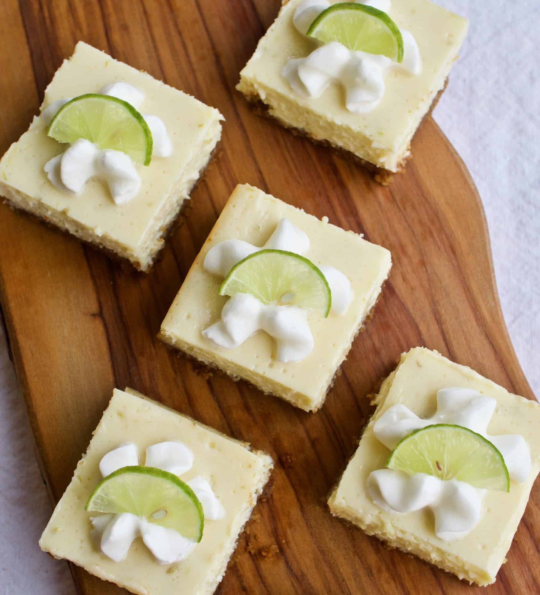 Key Lime Cheesecake Bars with Raspberry Sauce - Yummy Noises