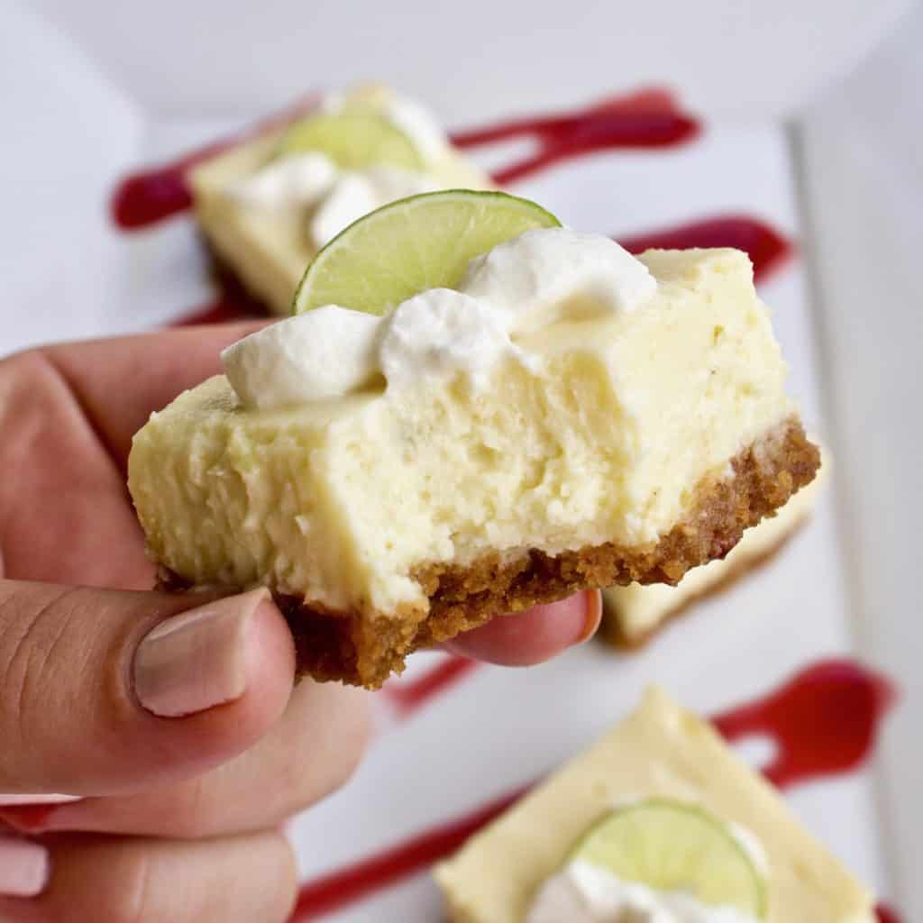 Key Lime Cheesecake Bars with Raspberry Sauce - Yummy Noises